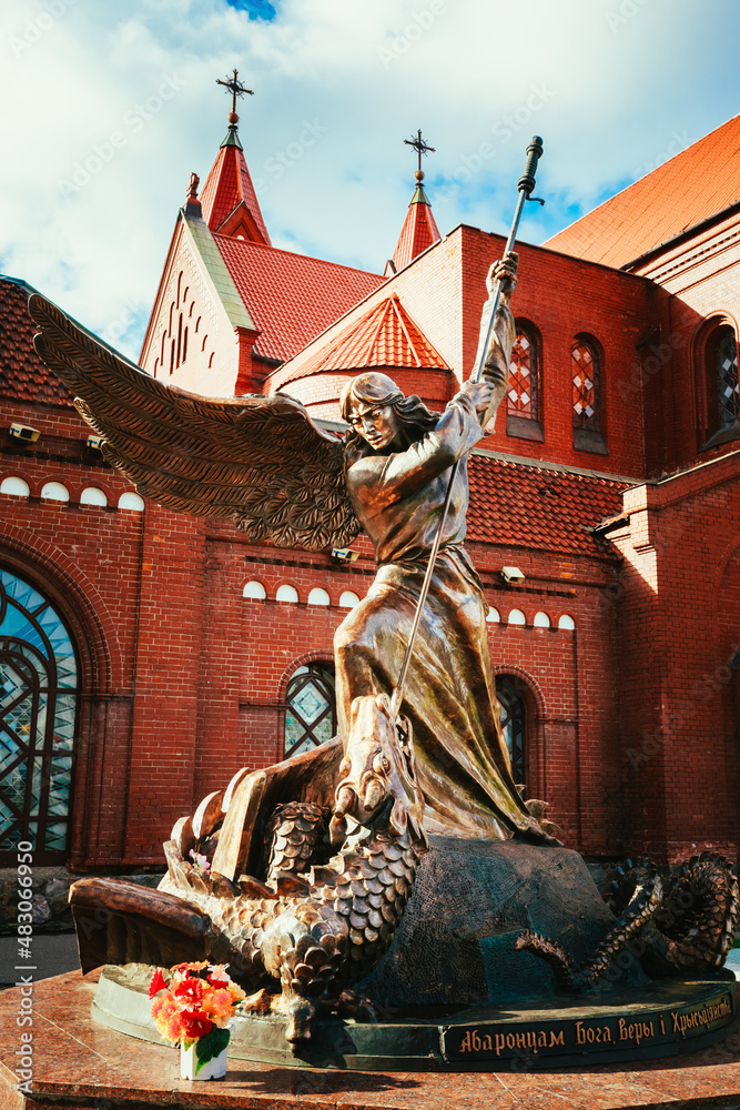 Statue of Archangel Michael with outstretched wings, thrusting spear ...
