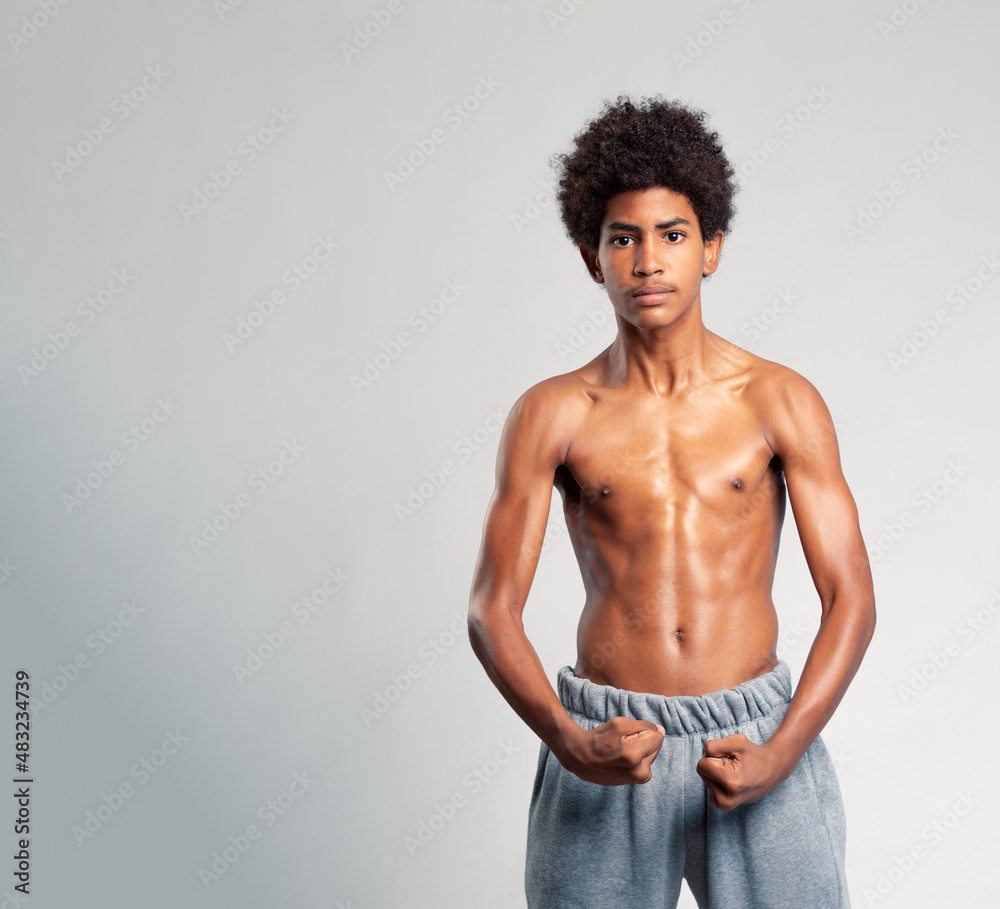 Strong Athletic handsome teenager afro Fitness Model Torso showing six ...