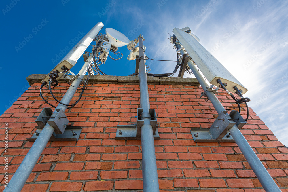 Brick wall with metal constructions for telecommunication data ...