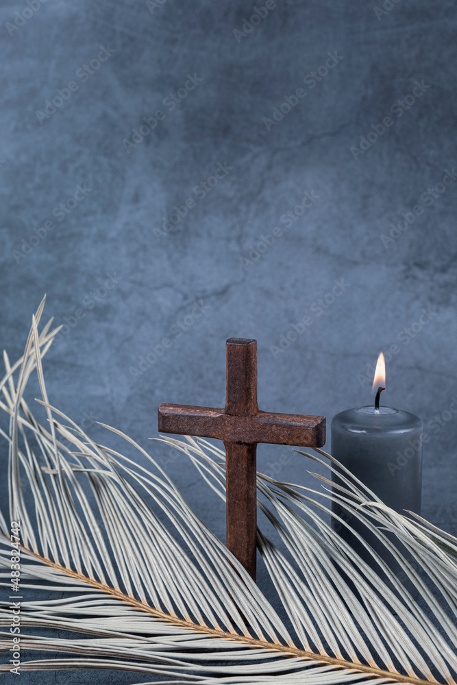 Catholic Cross with palm leaf and burning candle. Ash Wednesday, Lent ...