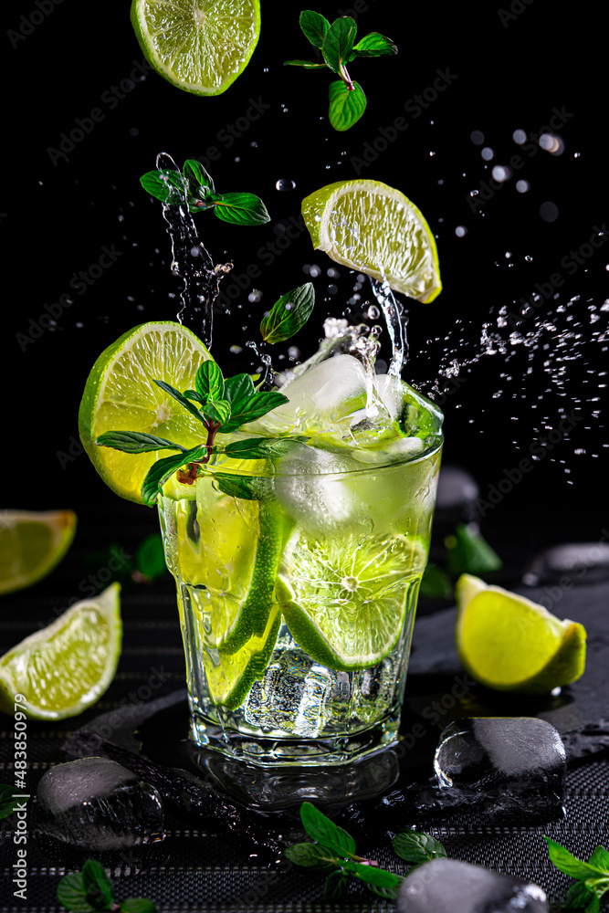 Preparation of cocktail drink known as mojito with alcohol, fresh mint ...
