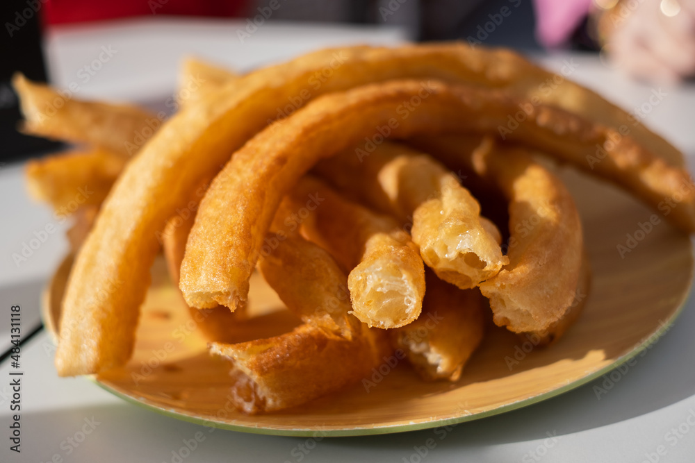 Typical serving of churros in Andalusia, Spain. selective focus Stock ...
