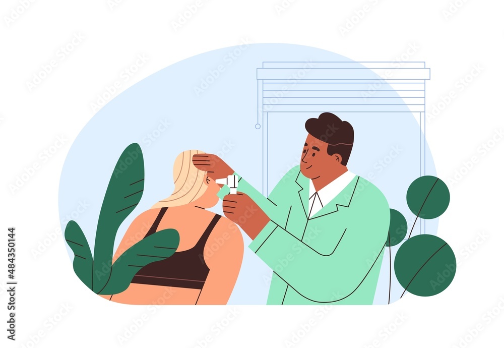 ENT doctor checking ear, removing earwax with tool. Patient at medical ...