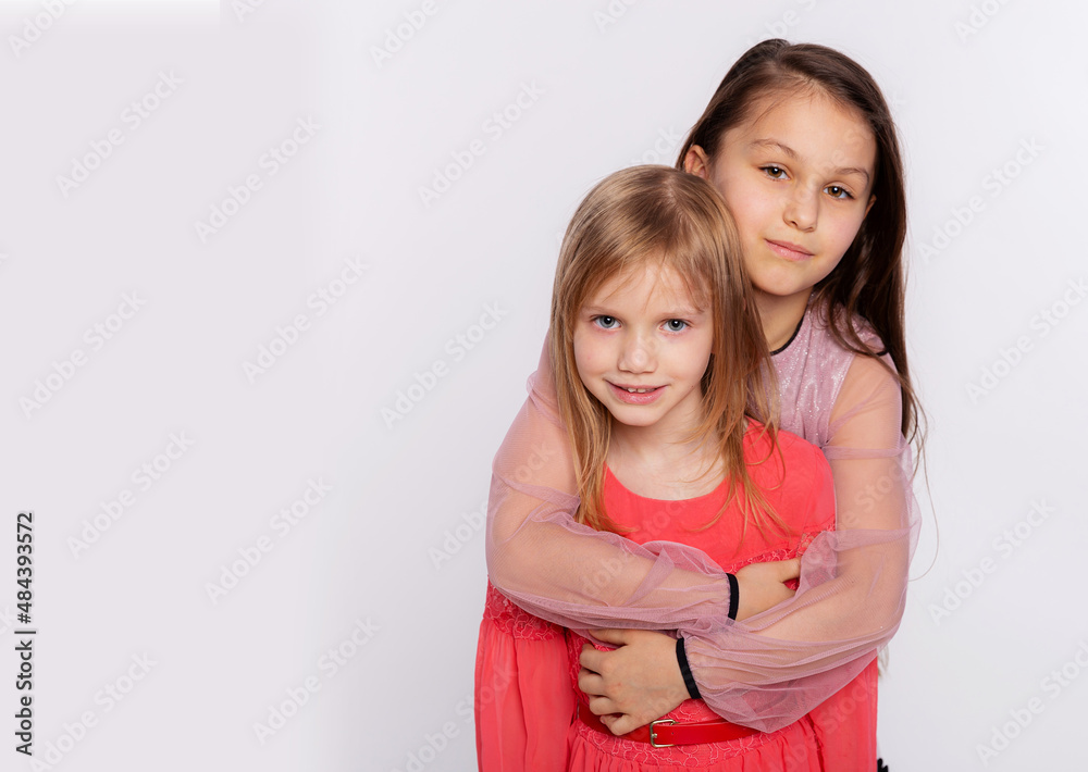 Two happy best friends or sisters kid girls hugging. Together having ...
