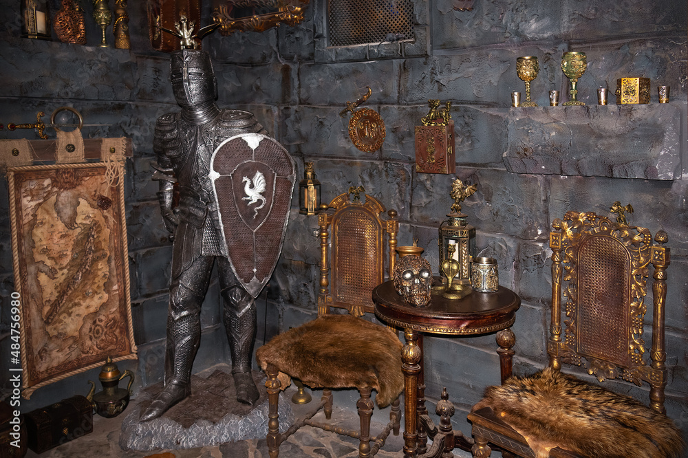 ภาพถ่าย Stock Knight armor with shield in medieval castle room with ...