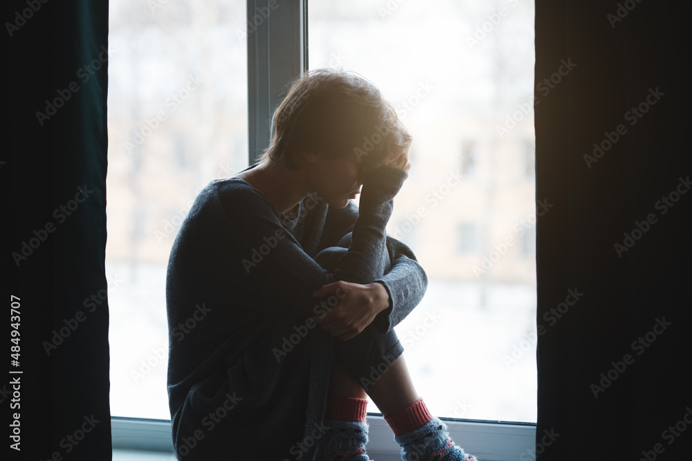 Sad stressed woman sitting alone suffering, crying, broken heart and ...