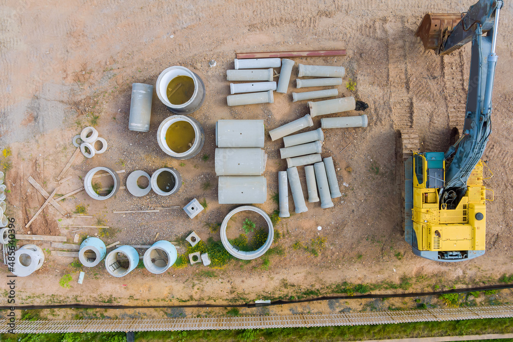 Aerial view with construction drainage system on concrete manholes are ...