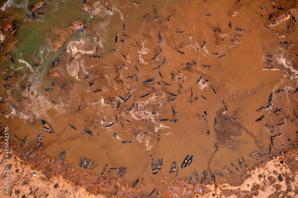 Aerial view of traditional fishing boats docked in a beautiful river ...