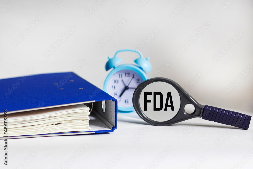 FDA concept. Concept of the Food and Drug Administration. Magnifier ...