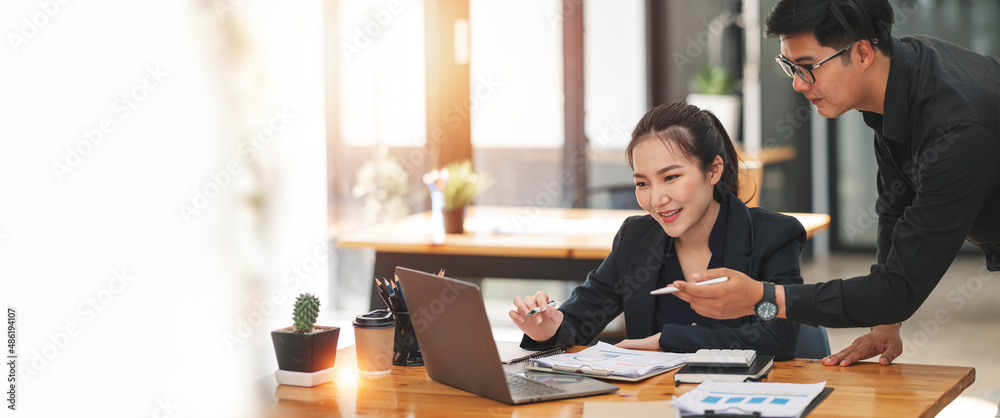 Professional business partner consulting the strategy. Two young asina ...