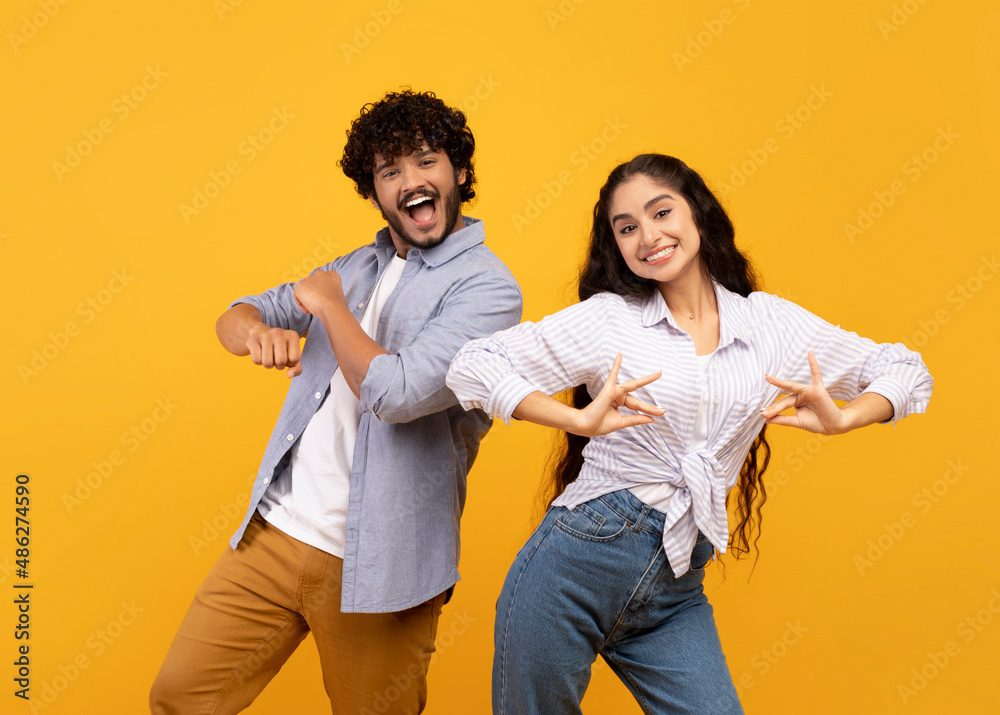 Having fun. Joyful young indian couple dancing and fooling around ...