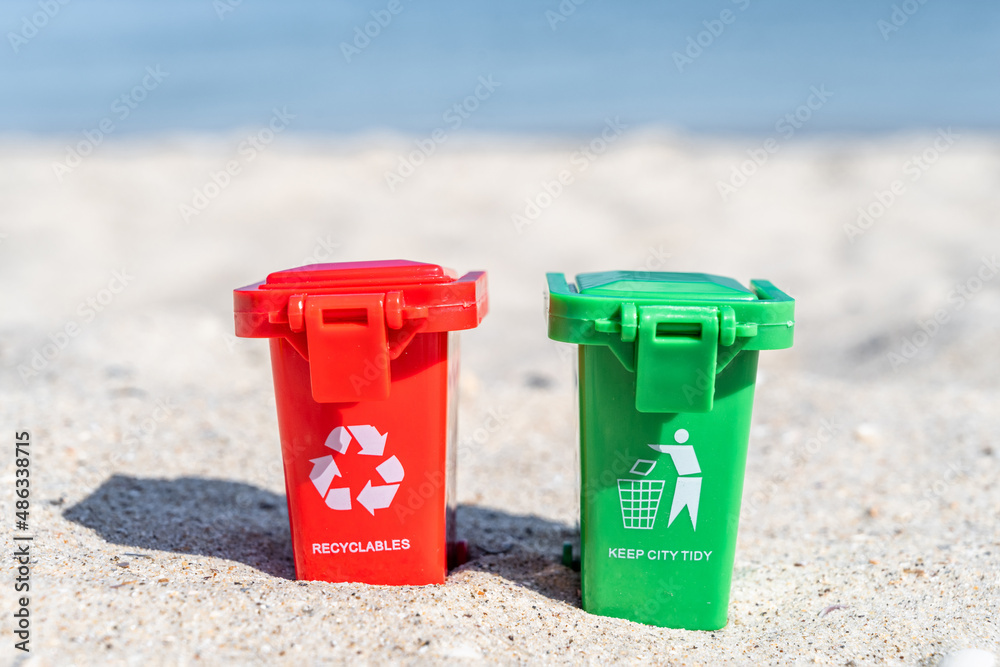 Different colored trash cans red and green with paper, plastic, glass ... Different colored trash cans red and green with paper, plastic, glass ...