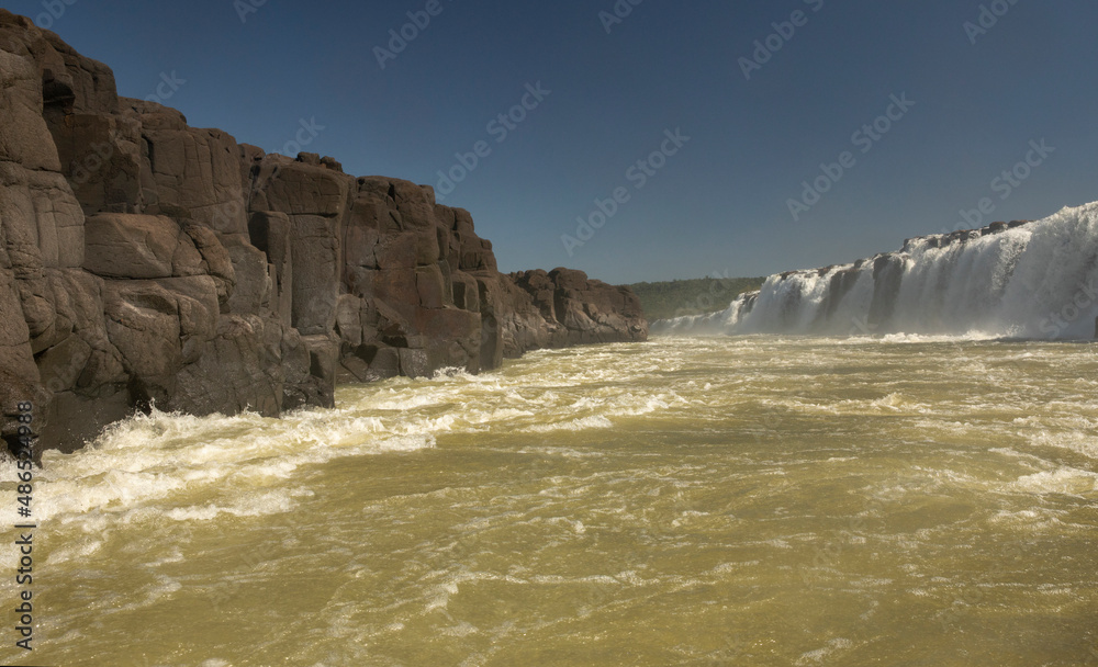 Sailing the river. The majestic Mocona waterfalls seen from the boat ...