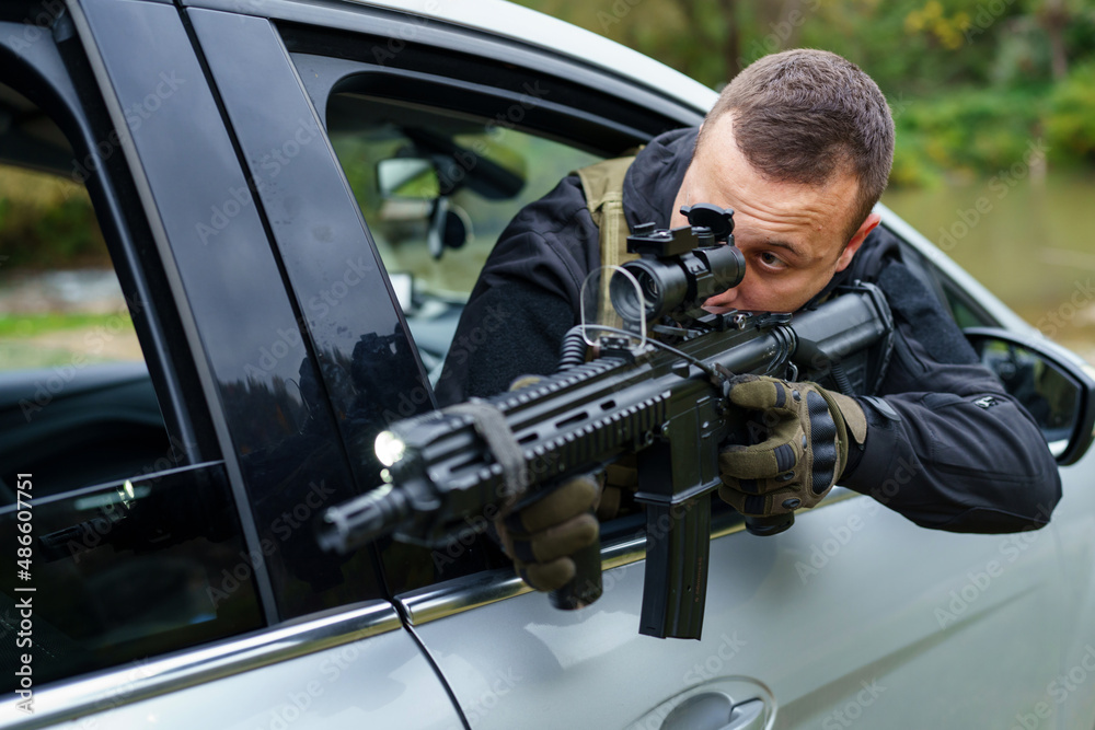 One man special force police or terrorist holding automatic weapon ...