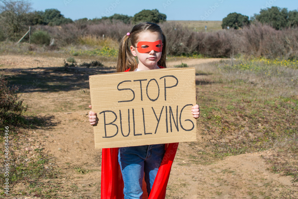 Little Girl Pretending To Be A Superhero With A Red Mask And Red Cape ...