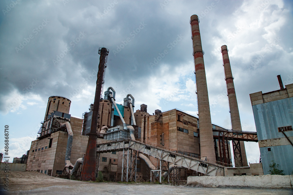 Panorama of old Soviet cement plant. Down-up perspective view ...