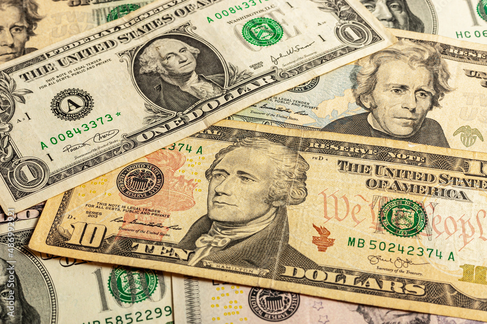 USA dollar bills. A few dollars of varying nominal values. Texture of ...