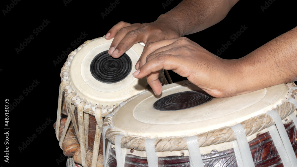 Tabla player playing the traditional Indian classical musical ...