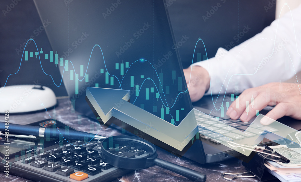 Photo Stock Businessman using computer analyzing sales data and ...