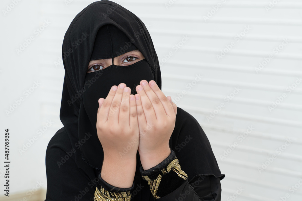 Little Asian Pakistani Muslim girl wearing black hijab with beautiful ...