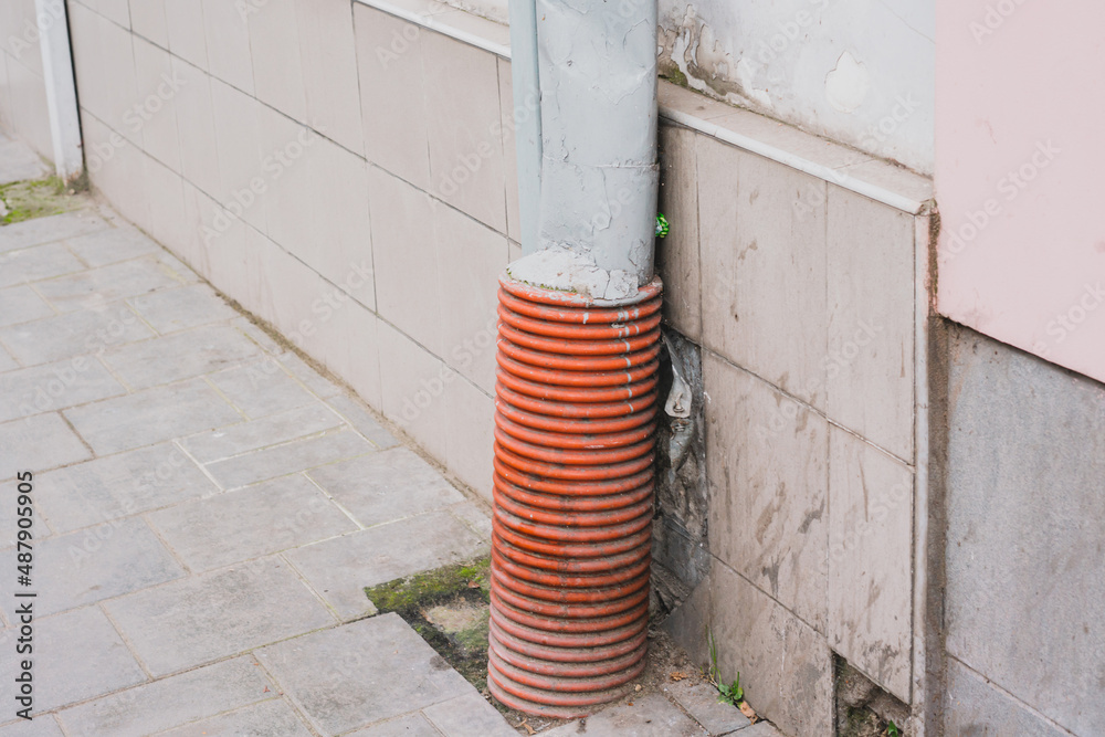 Drainage of a building right under the ground. Plastic and steel tube ...