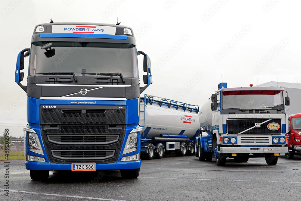 Two Volvo Trucks Powder-Trans in front of Tank Trailer side by side ...