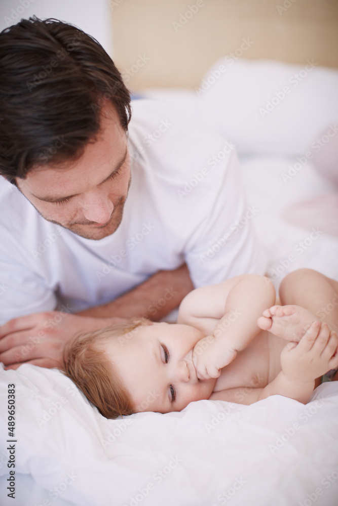 Watching his dearest fall asleep. A devoted young dad spending time ...