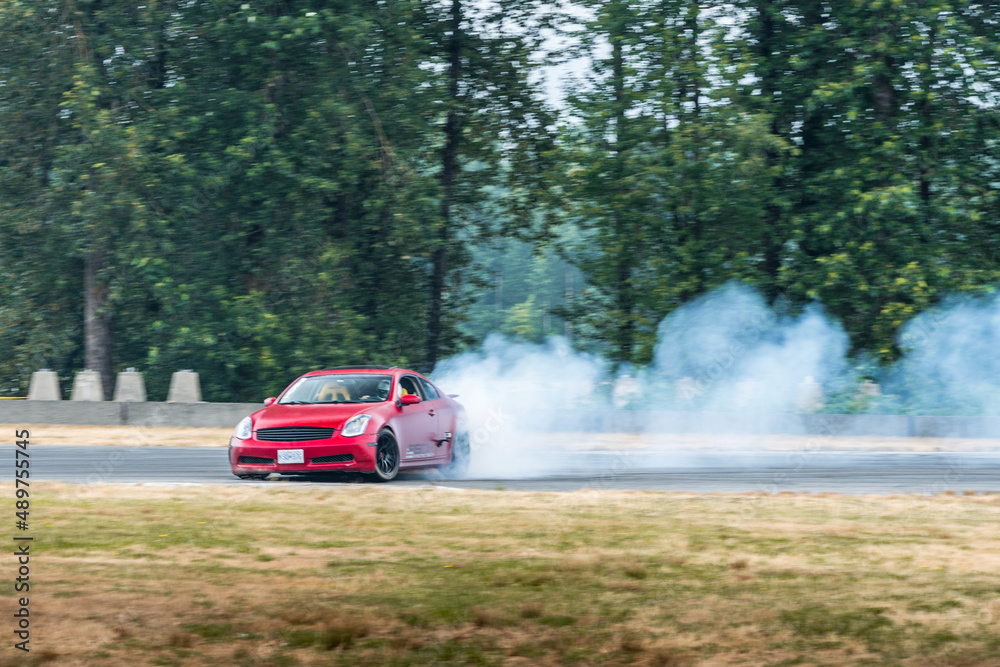 Foto de Stock Red Drift Car / Race car drifting around corner very fast ...
