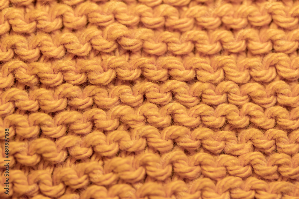 Macro abstract background of hand-knitted yarn fabric texture with a ...