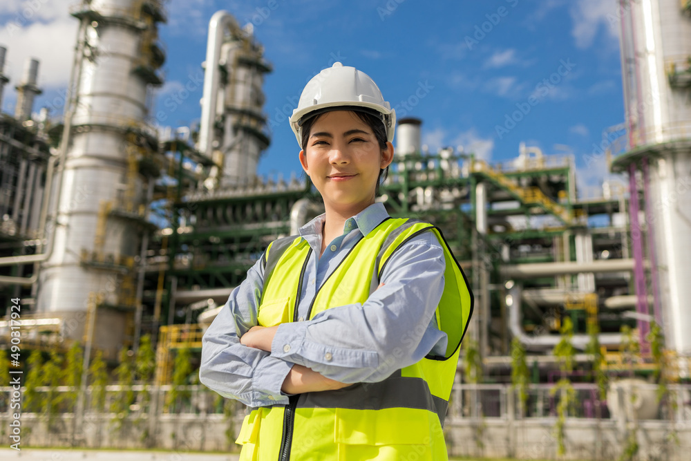 Asian engineer manager woman with white safety helmet standing front of ...