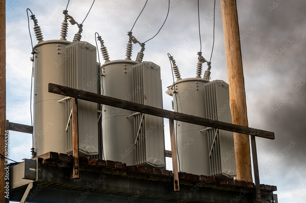 High voltage elevated transformer bank with smoke being emitted before ...