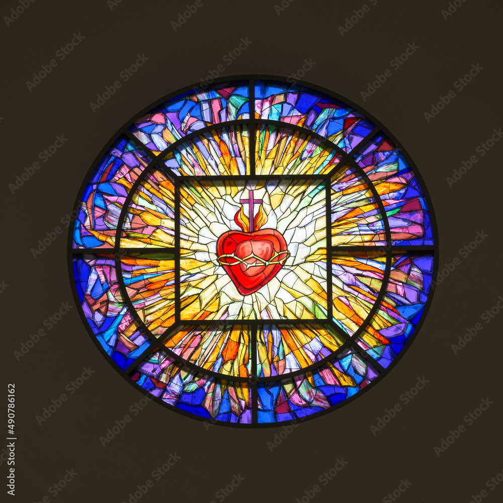 Sacred Heart of Jesus round stained glass window inside the Co ...