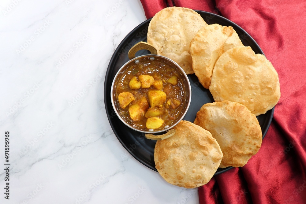 Indian cuisine - Puri Bhaji. It is a traditional breakfast dish in ...