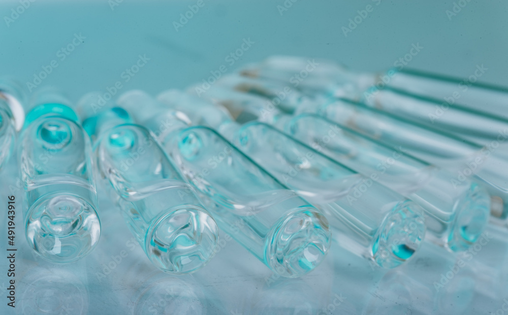 Glass medical ampoule vial for injection. Medicine is liquid sodium ...