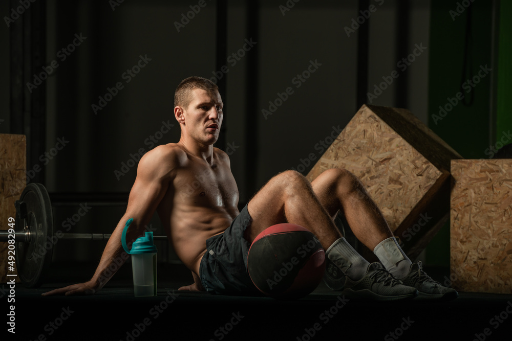 Shirtless pro athlete doing russian twist abs workout. Close up photo ...