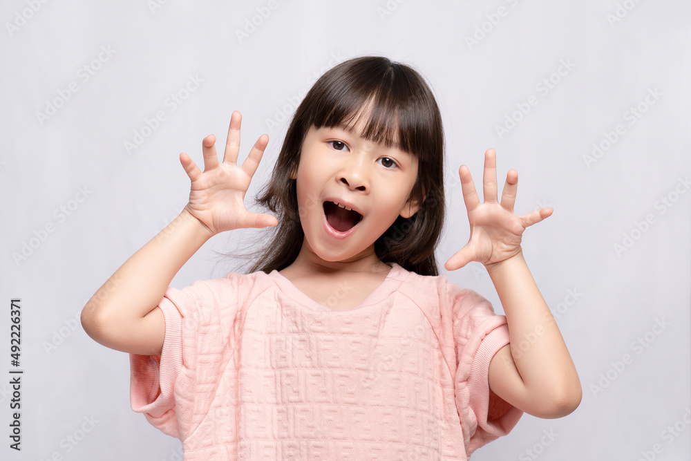 Young beautiful Asian girl playing peekaboo smiling joyfully standing ...