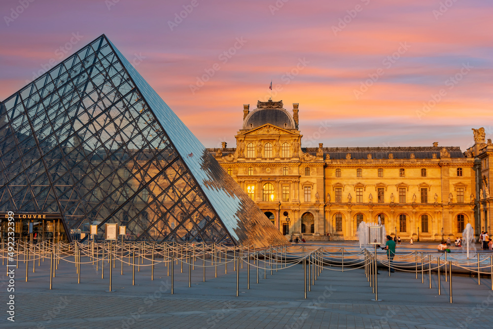 Louvre museum and pyramid at sunset, Paris, France. Stock Photo | Adobe ...