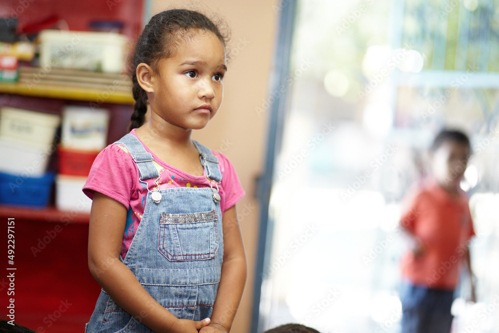 Education is the key to a better future for her. A small cute pre ...