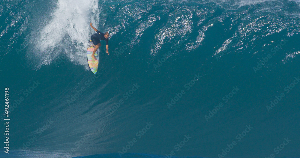 Surfer surfing big ocean barrel tube wave at Pipeline in north shore of ...