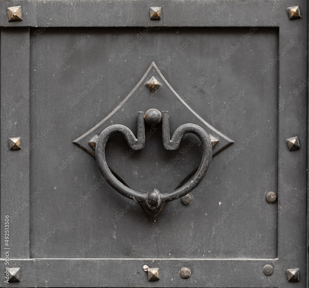 Black metal background, steel strip border with rivets and bolts. In ...