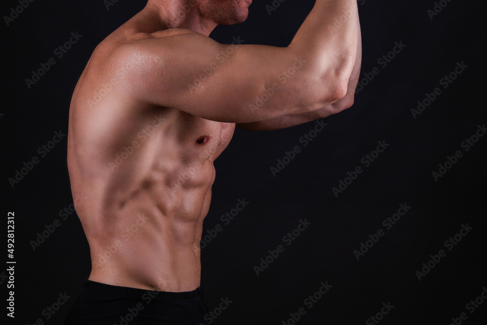 Professional bodybuilder posing over isolated white background. Front ...
