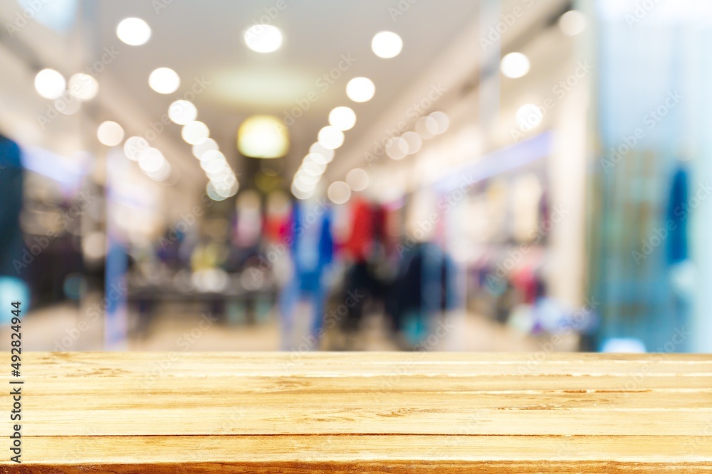 Wood table top with supermarket grocery store background for product ...
