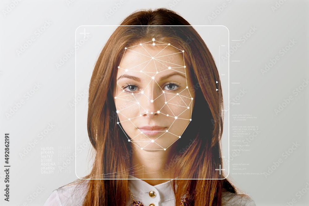 Serious business woman and smart technology for face recognition ...