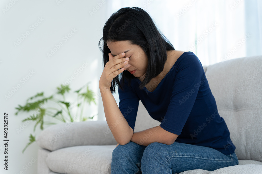 Depression and mental illness. Asian woman disappointed, sad after ...