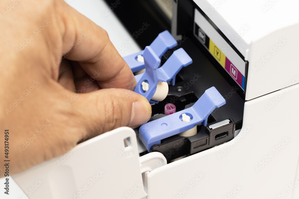 Technicians are installing setup the ink and Insert ink into the fill ...