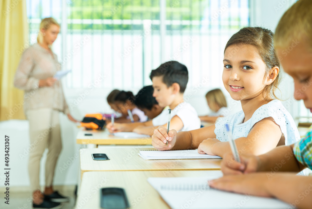 Photo Stock Side view of group of primary school students and positive ...