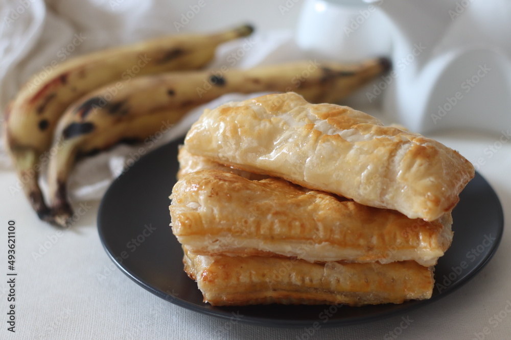 Plantain puff. Ripe plantain slices wrapped in a puff pastry sheets and ...