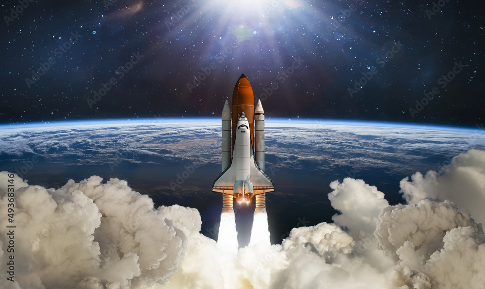 Space shuttle flight in space. Rocket launch. Earth planet and clouds ...