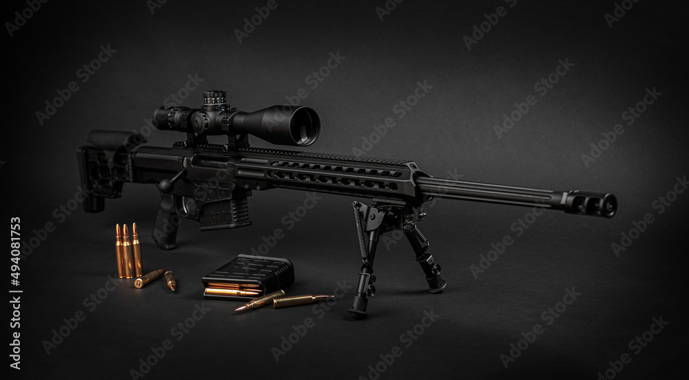 Modern powerful sniper rifle with a telescopic sight mounted on a bipod ...