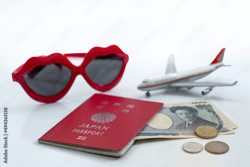 Airplane toy, Japanese Yen Bank Note inside passport book, travel ideas ...